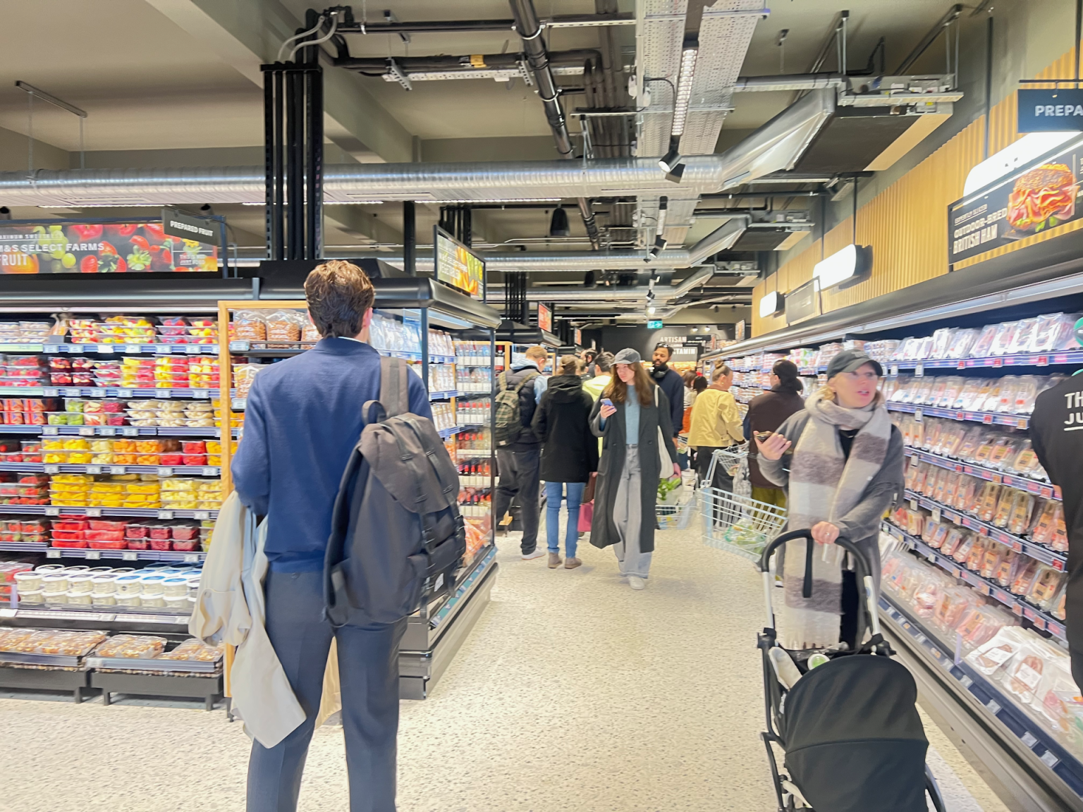 Hello Putney: M&S opens to queues, flowers, and eight years of waiting ...
